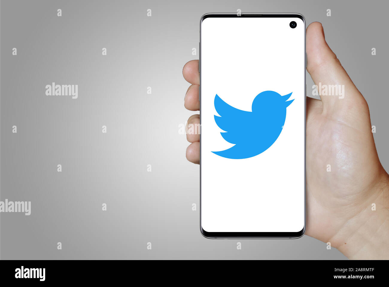 Logo of public company Twitter, Inc. displayed on a smartphone. Grey ...