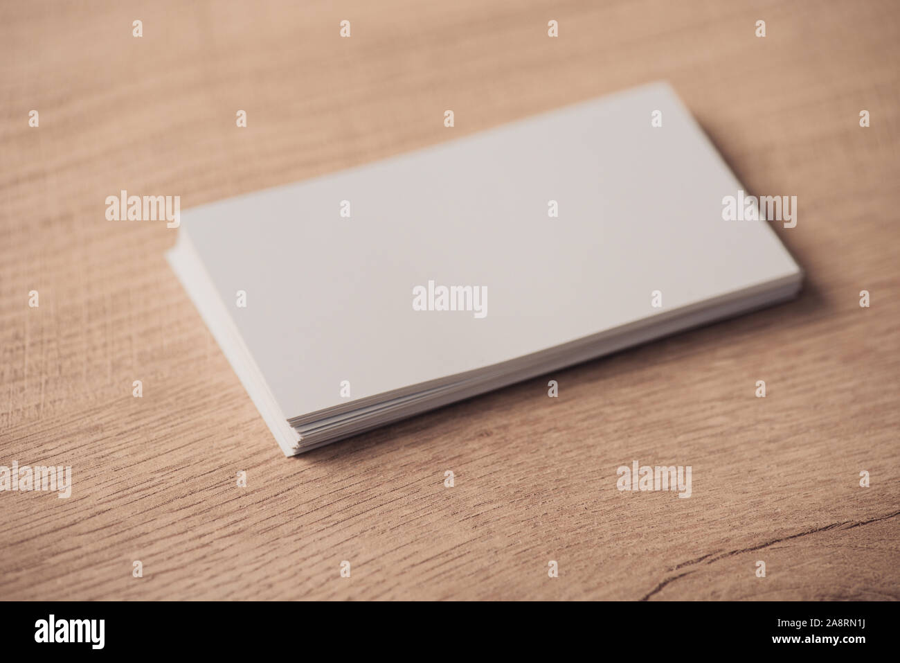 white empty business cards stacked on wooden textured surface Stock ...