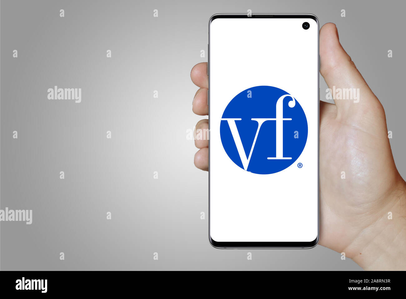Logo of public company V.F. Corp. displayed on a smartphone. Grey ...