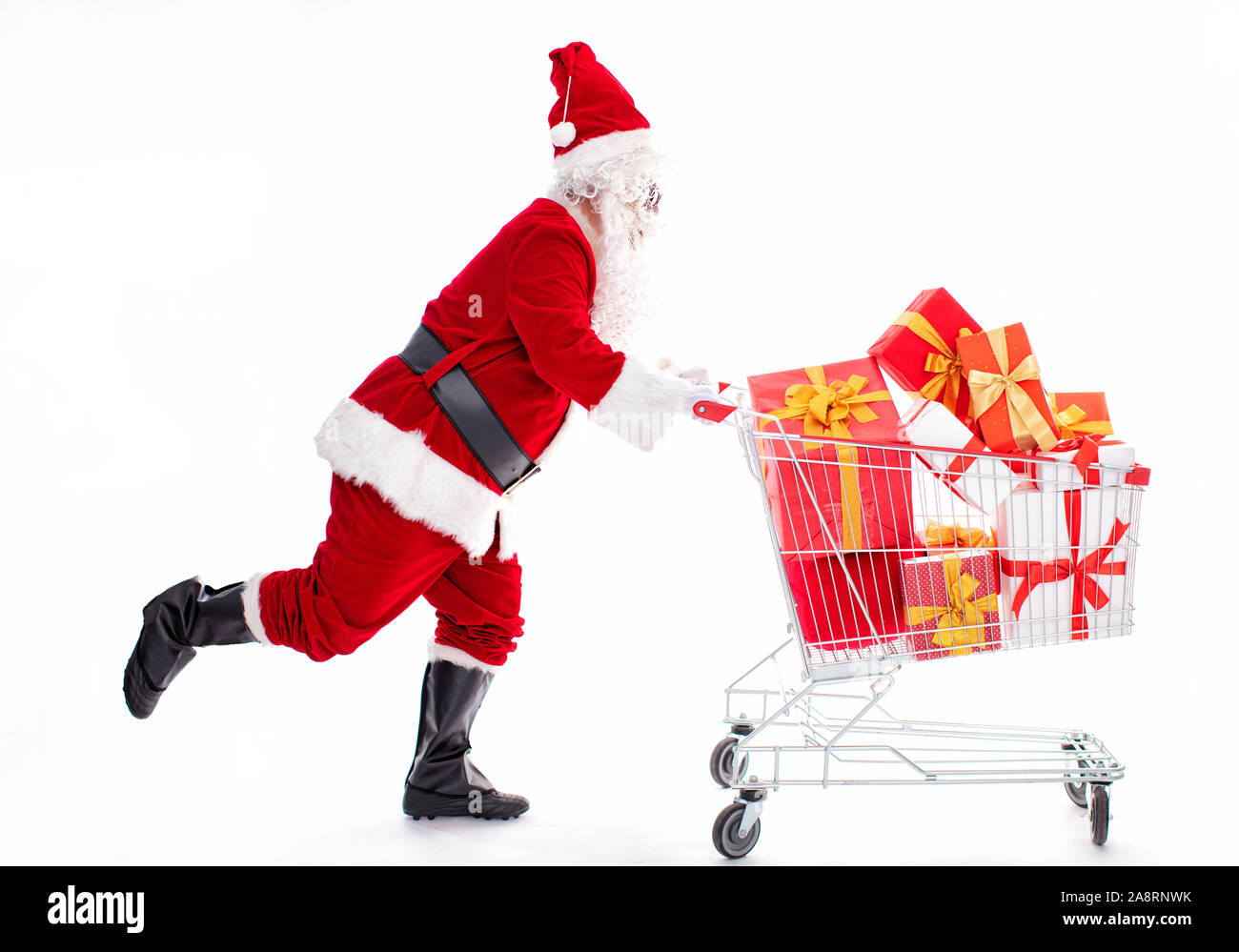 Happy Santa Claus with Christmas shopping cart Stock Photo - Alamy
