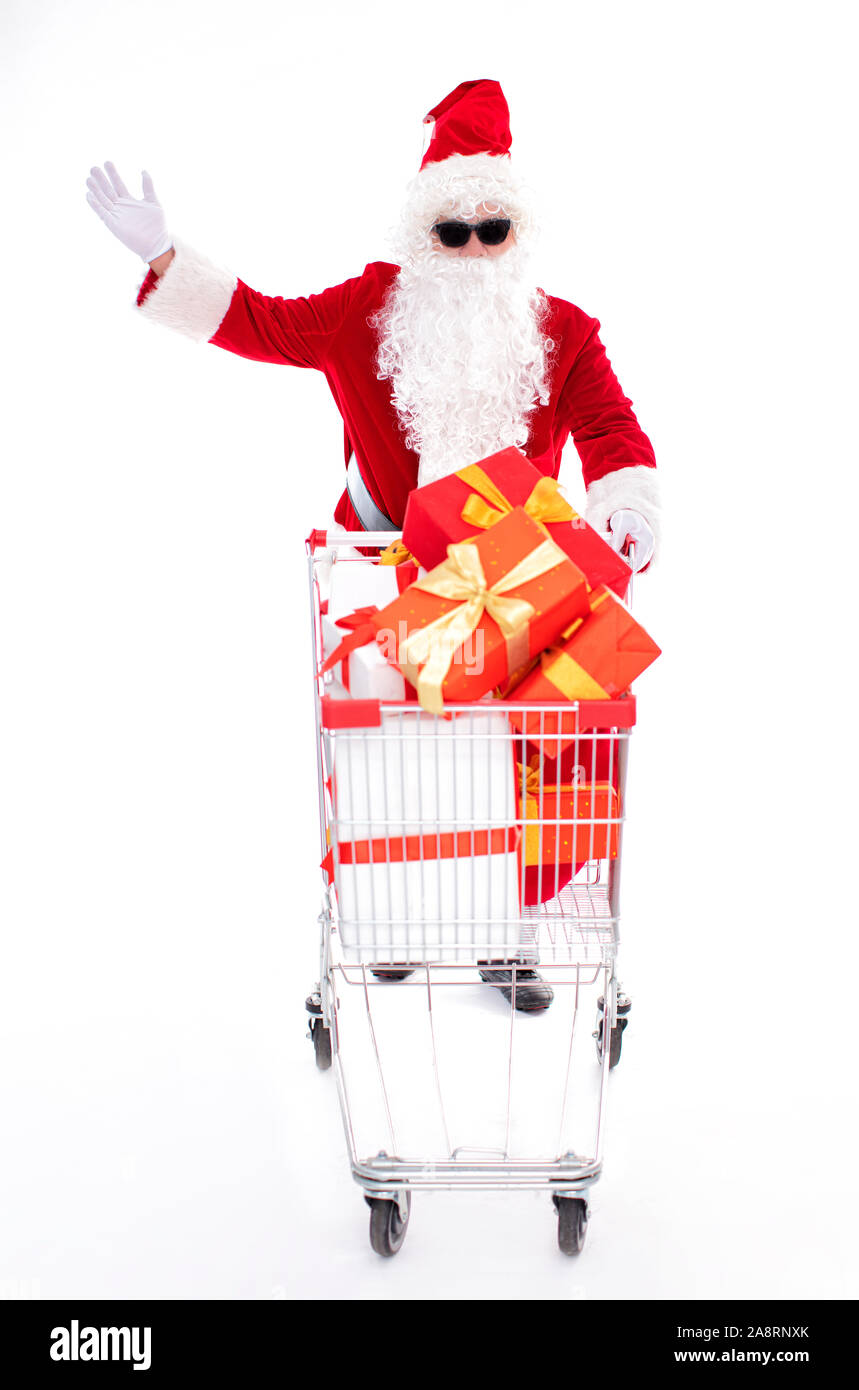 Happy Santa Claus with Christmas shopping cart Stock Photo - Alamy