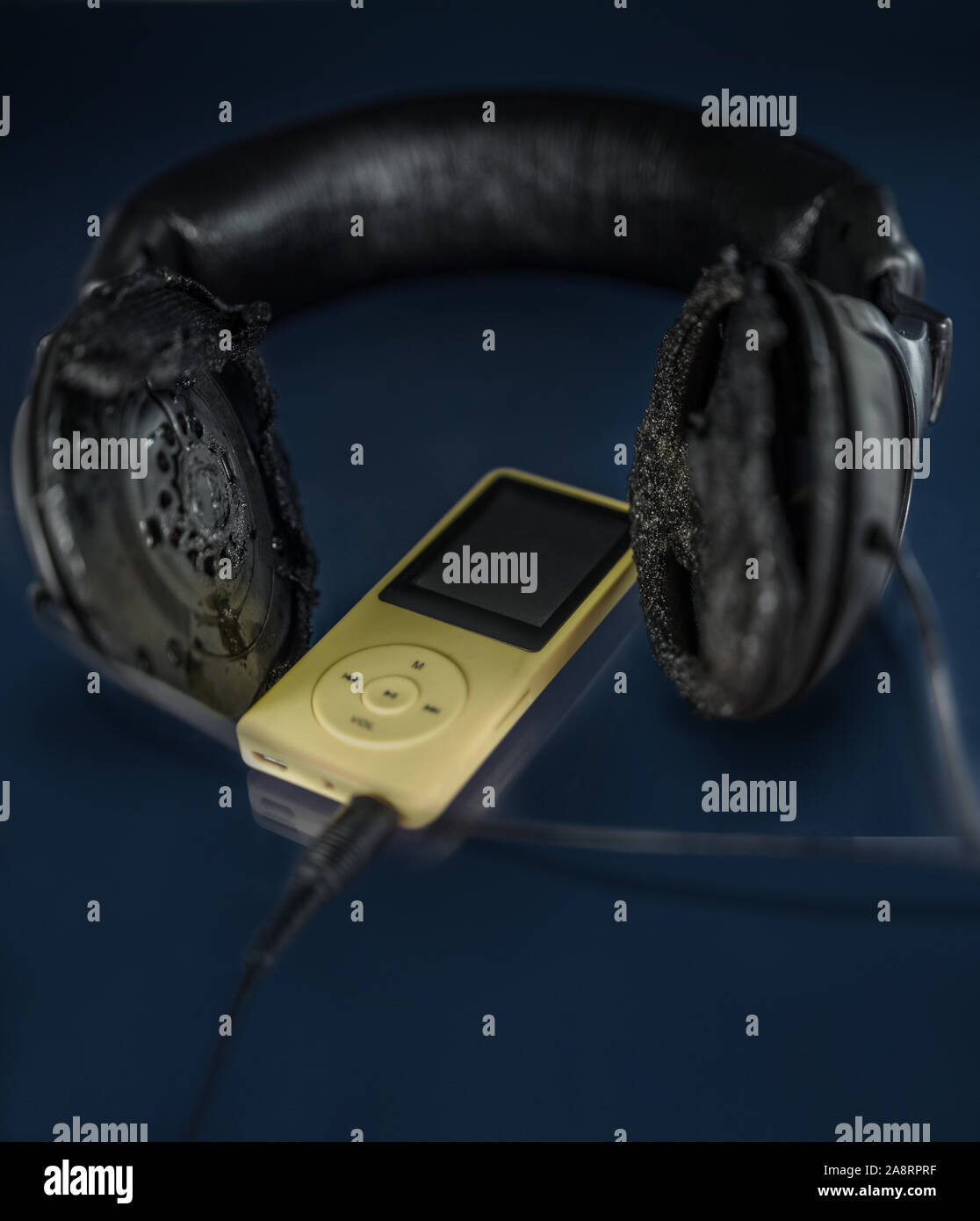 Too loud: burned headphones attached to a personal music player. Low ...