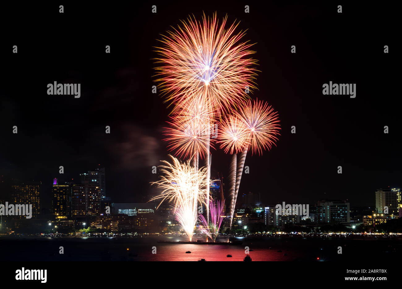 Happy new year fireworks over cityscape at night.holiday celebration ...