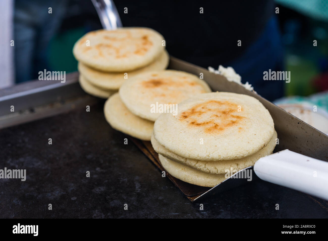 Arepas, traditional Venezuelan corn patties, at a street food market ...