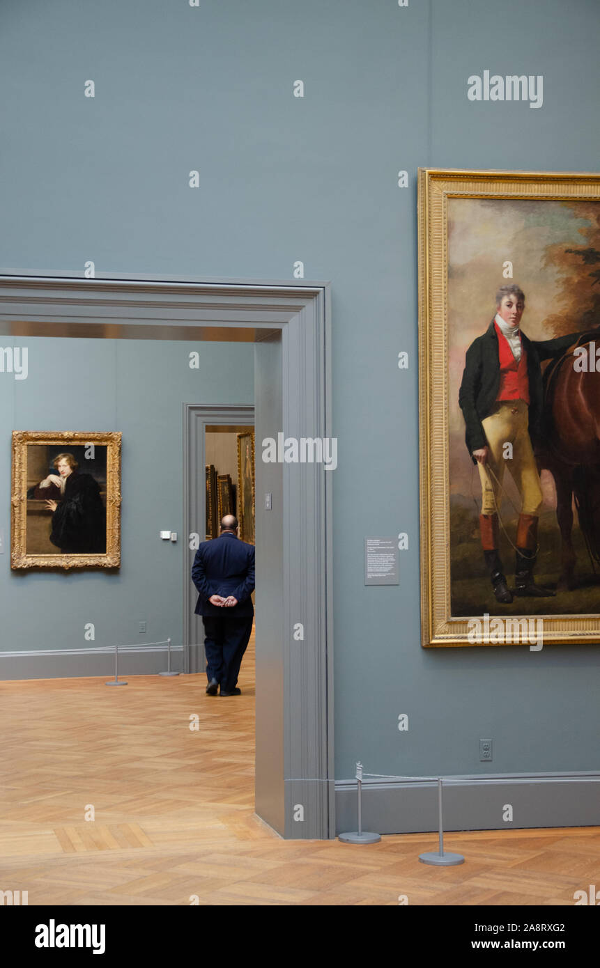 A security guard stands amongst paintings at The Metropolitan Museum of ...
