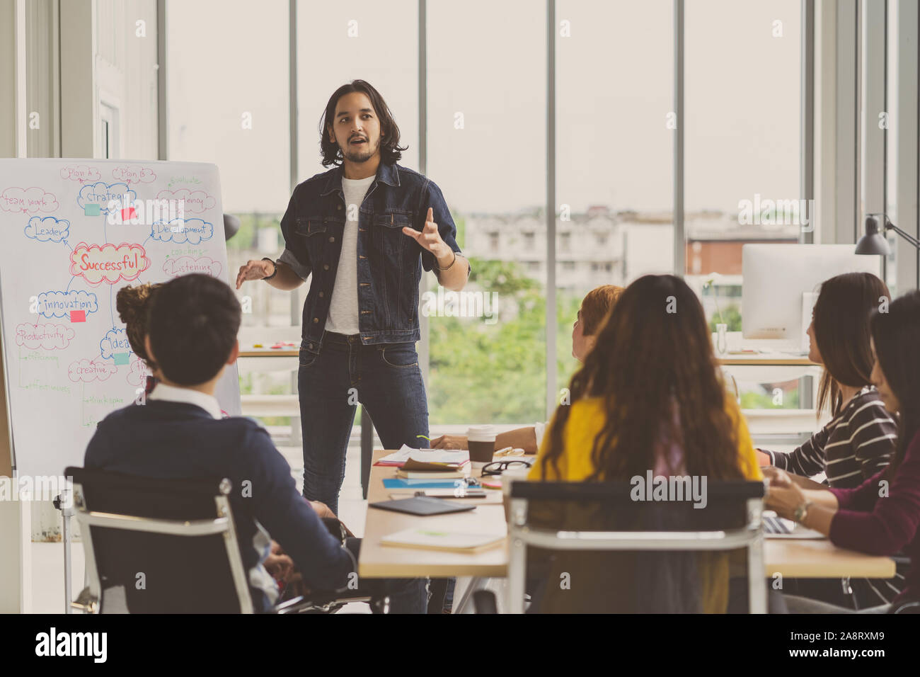Asian Creative manager man presenting the successful ideas in front of ...