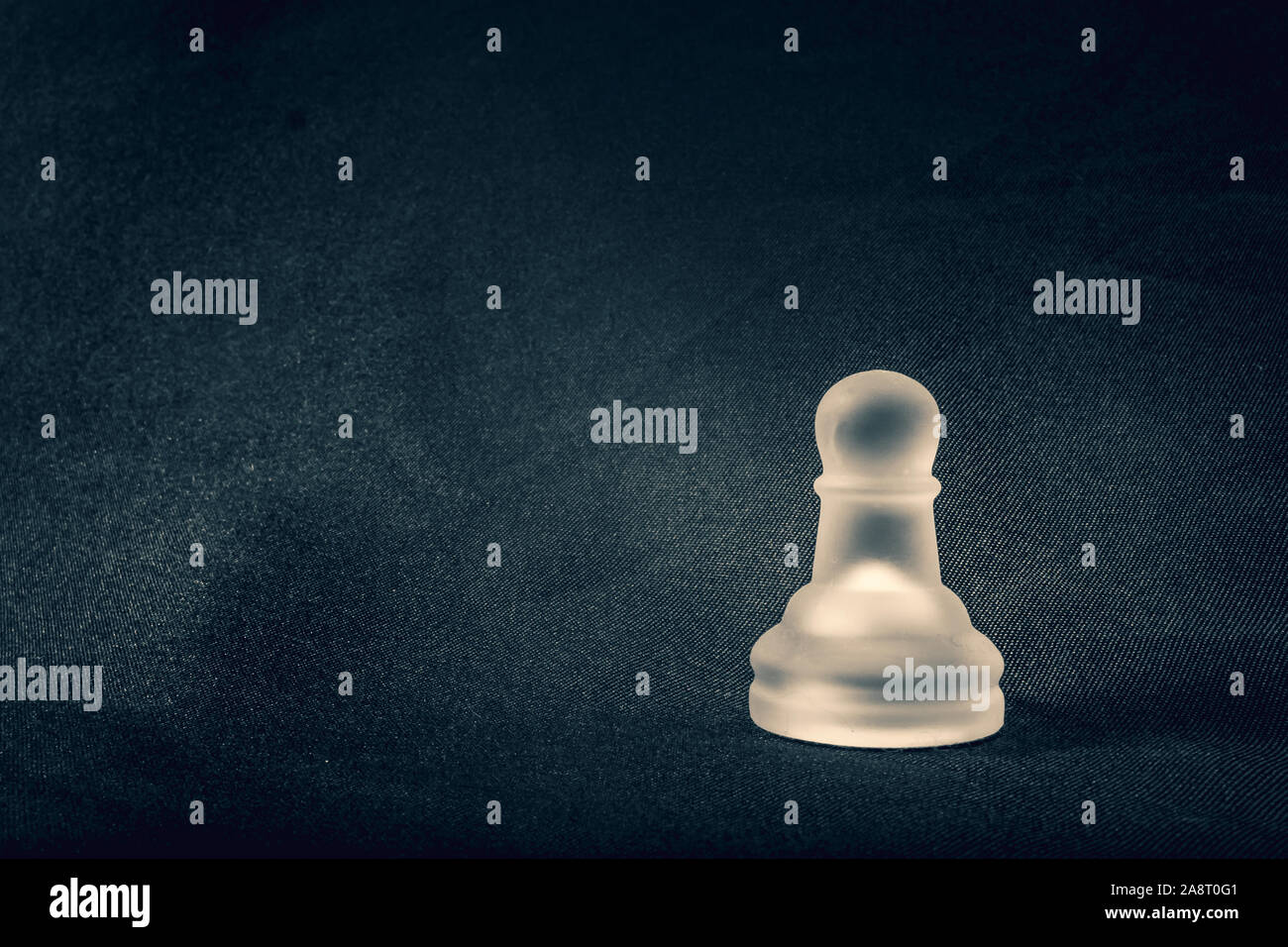 forsted white glass Pawn chess piece on dramatic background Stock Photo ...