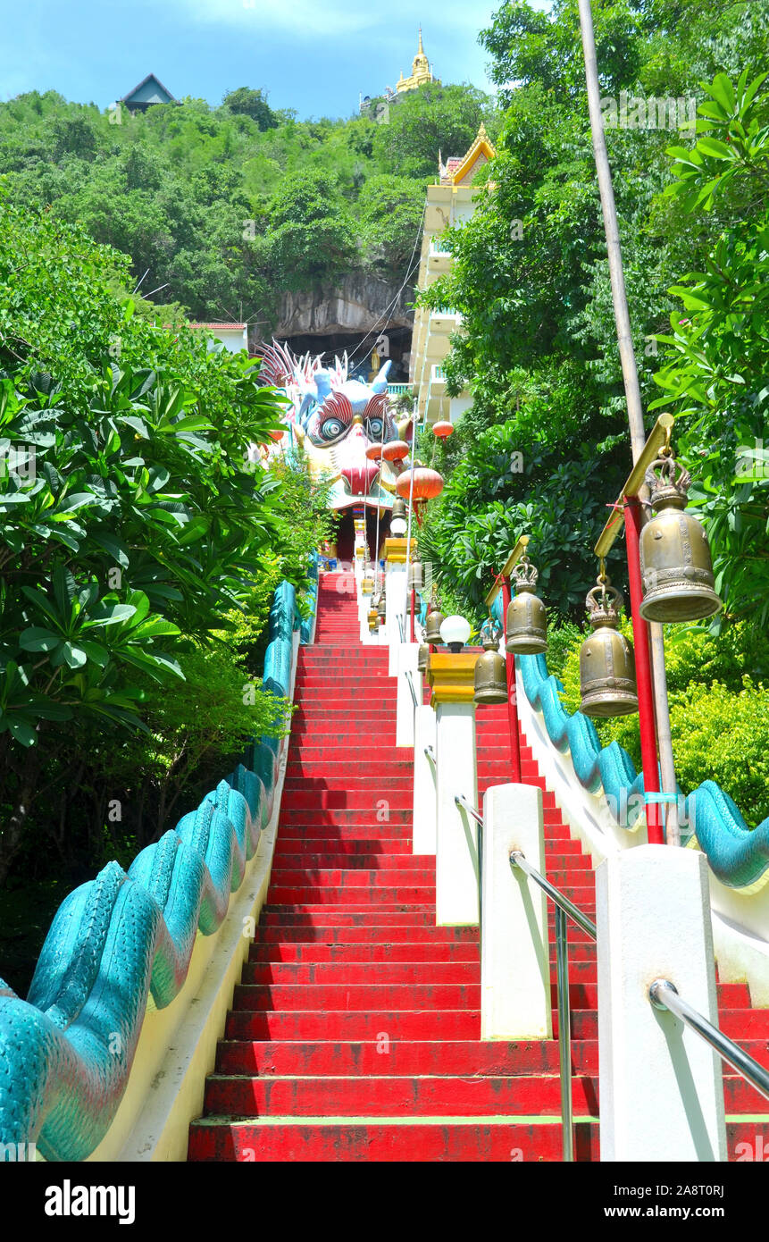 The red stairway leading to the dragons mouth at Wat Tham Khao Noi in Kanchanaburi Thailand Asia ...