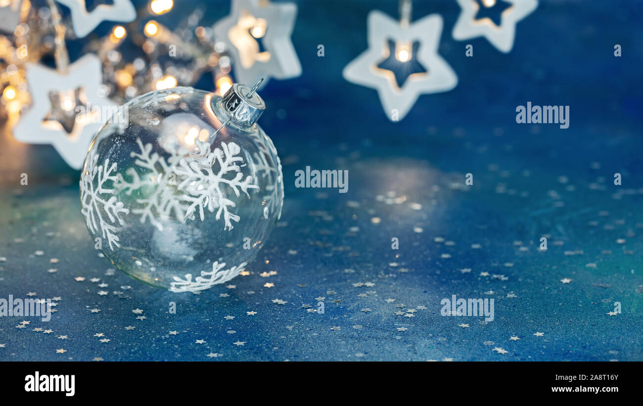 festive new year background with christmas tree glass ball and glowing ...
