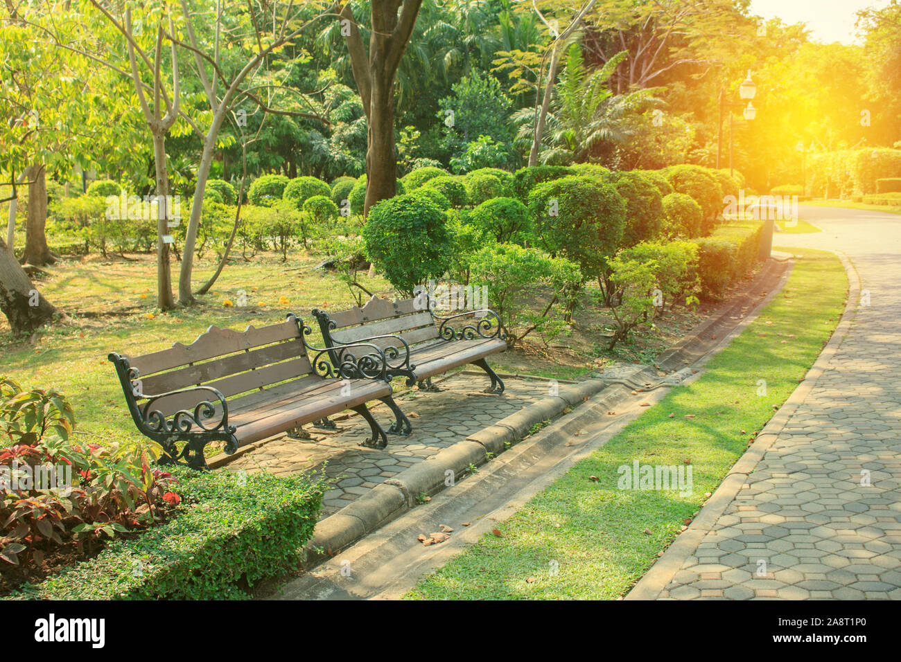 Bench in beautiful city park for relax on vacation Stock Photo - Alamy