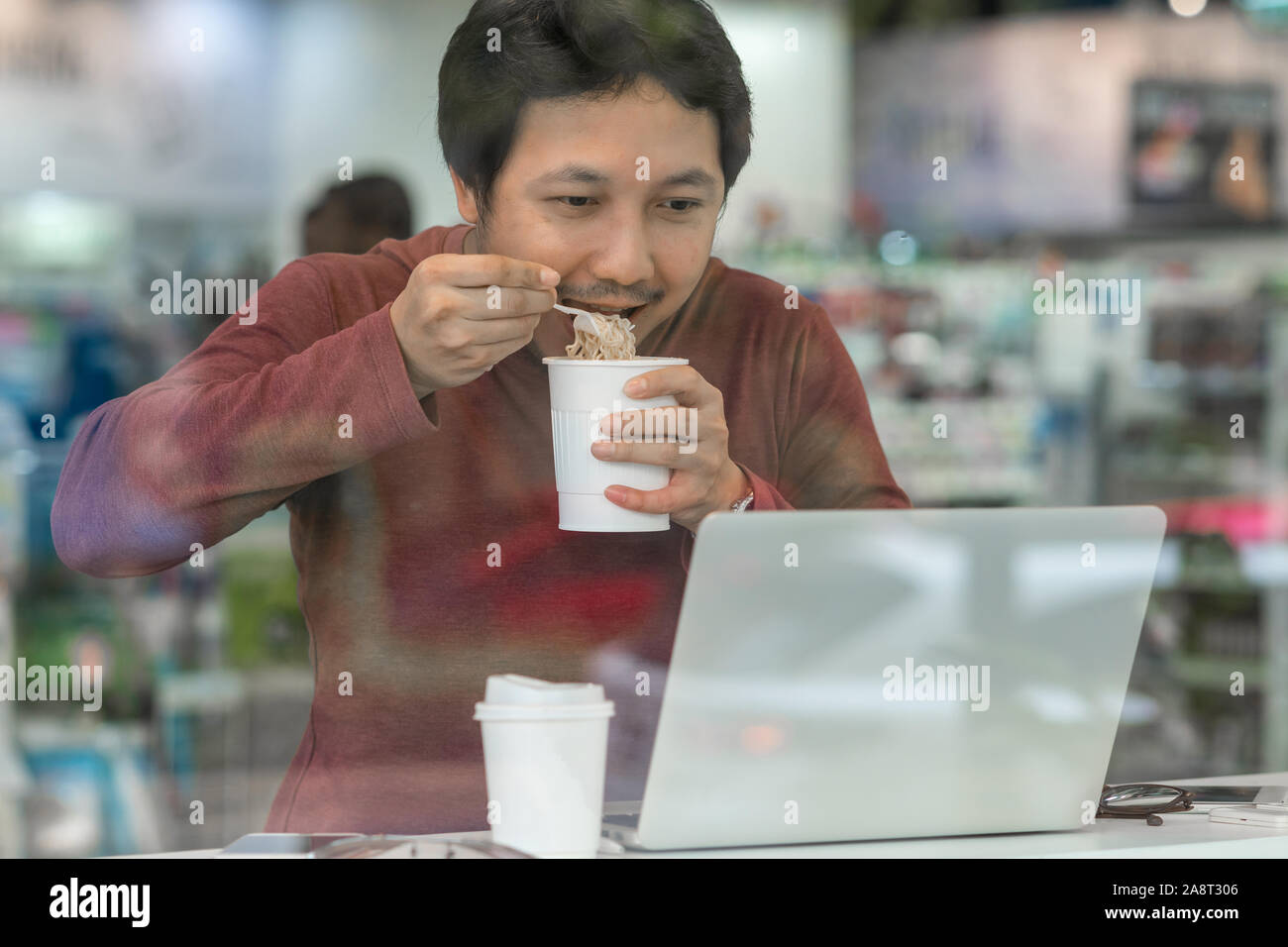Businessman eating noodles asia hi-res stock photography and images - Alamy