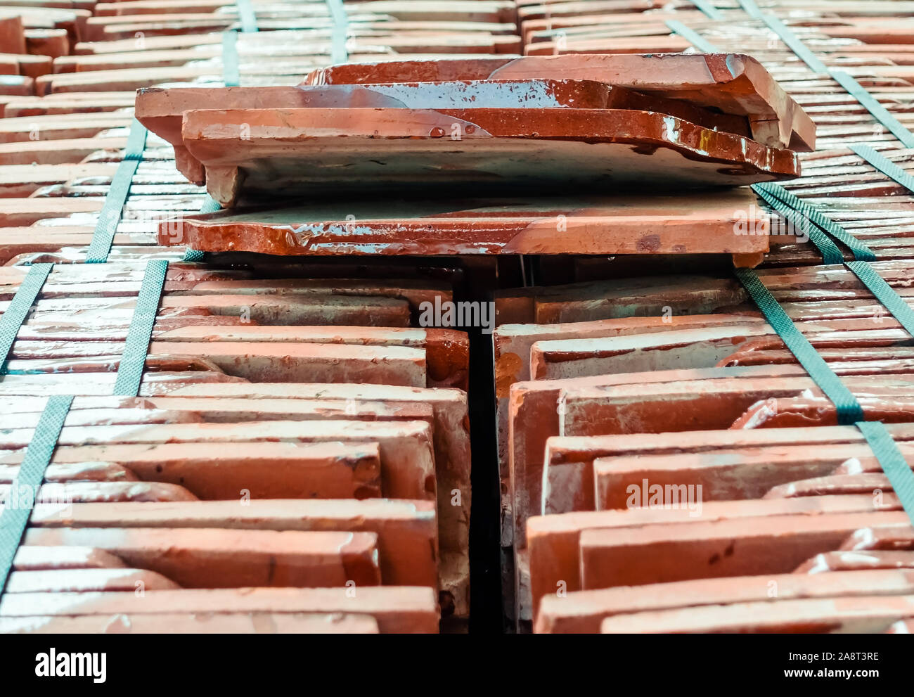 Close up to many pile of roof tiles traditional clay stack for a ...