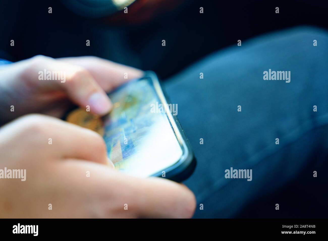 Mobile gaming concept. Man play phone. Man play mobile game in the home ...