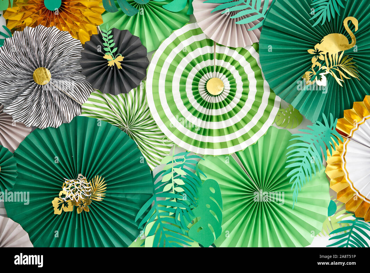 Green, emerald, gold and yellow papers circle shape of origami ...