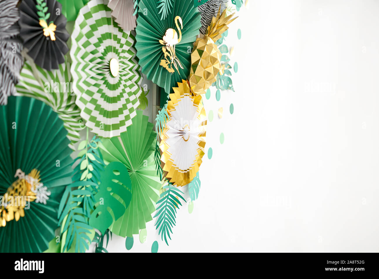 Green, emerald, gold and yellow papers circle shape of origami ...