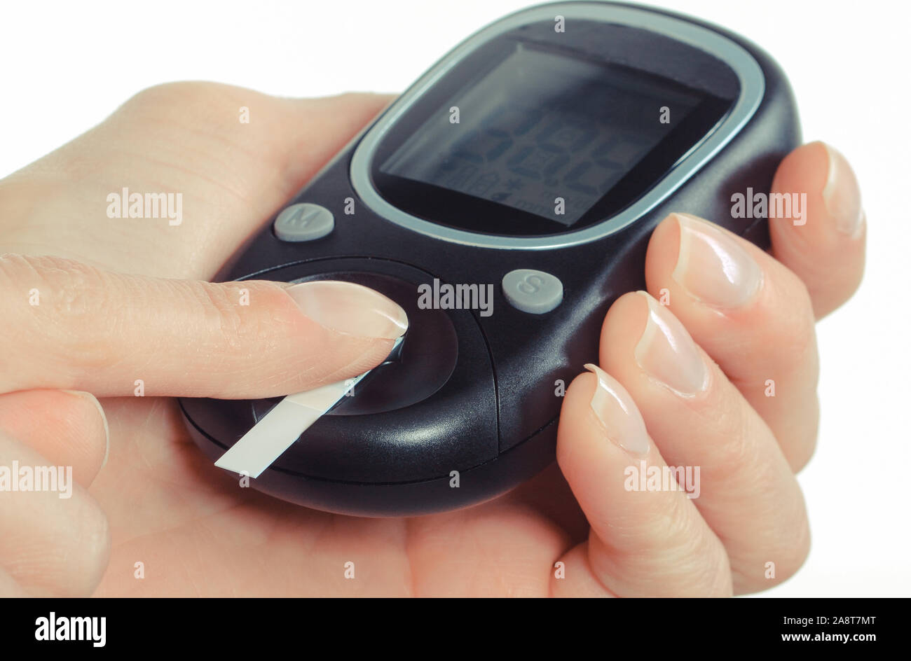 Finger with glucose meter. Checking and measuring sugar level Stock ...