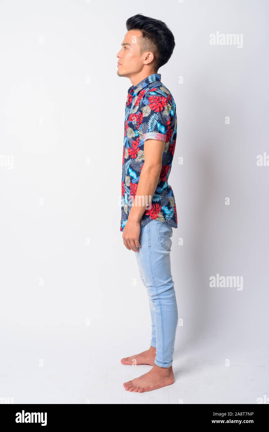 Full body shot profile view of young Asian man Stock Photo - Alamy