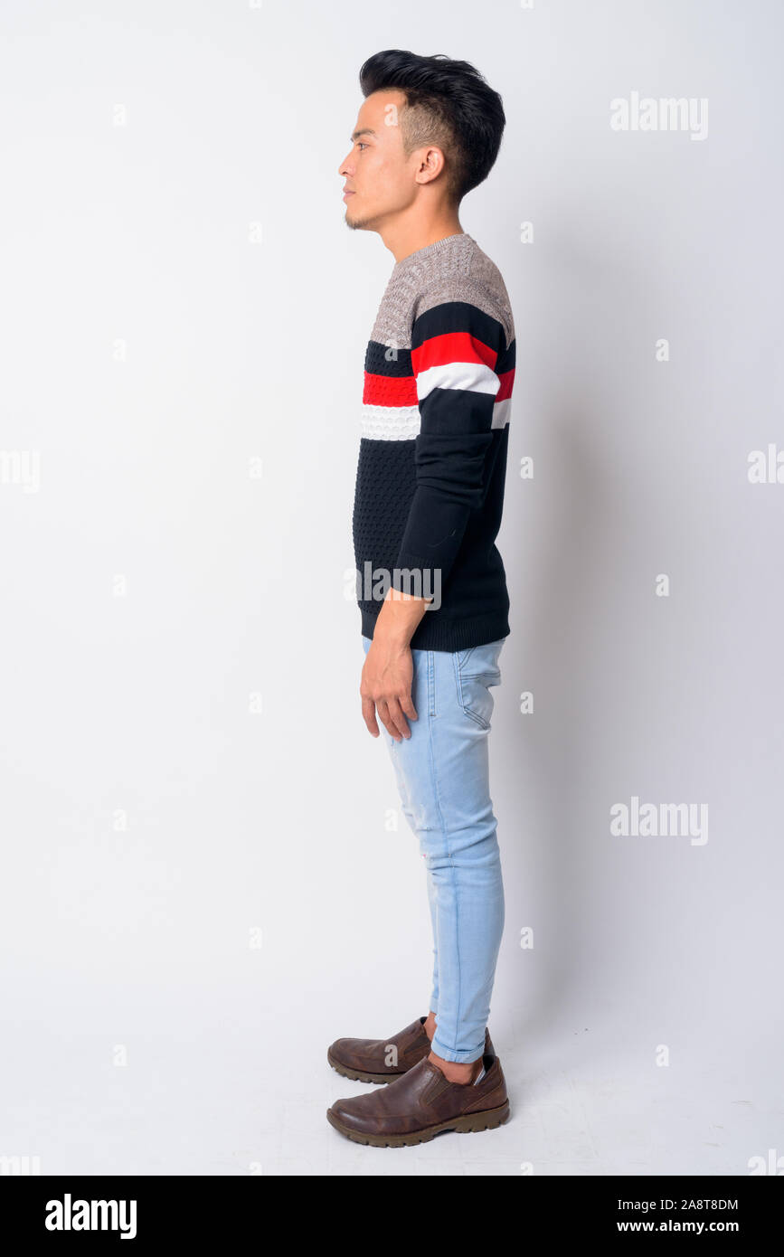 Full body shot profile view of young Asian man Stock Photo - Alamy