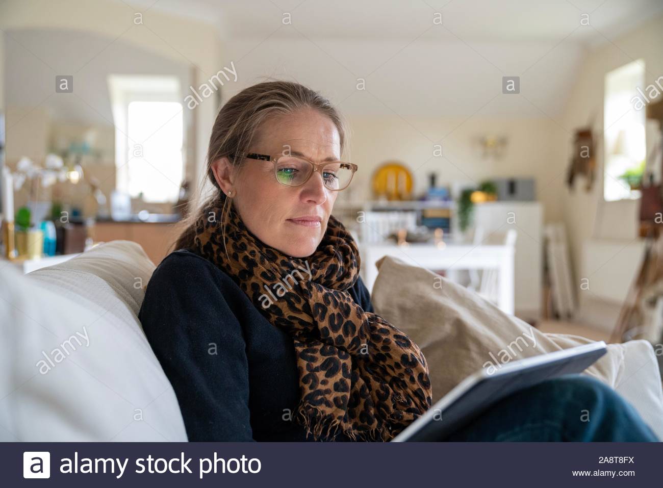 A Woman Reading Her iPad Stock Photo - Alamy