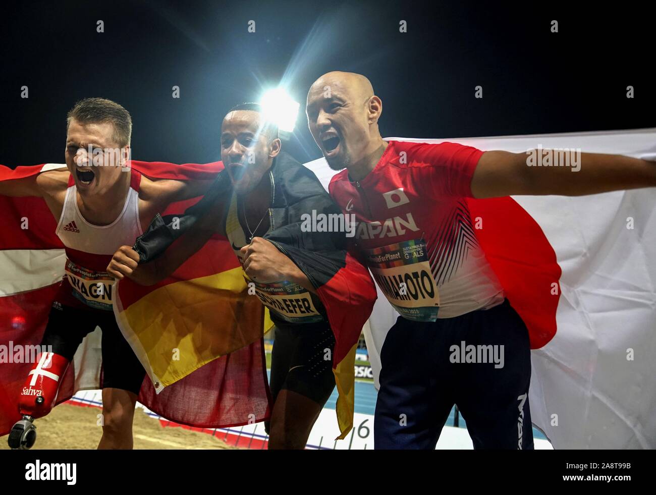 Leon Schaefer (C) of Germany poses for a photo after winning the men's ...