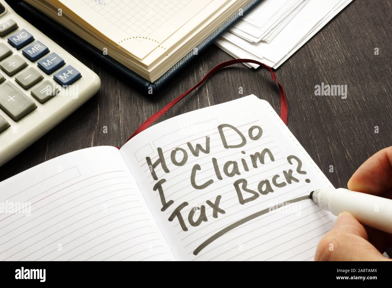 Tax refund concept. How do I claim tax back sign Stock Photo - Alamy