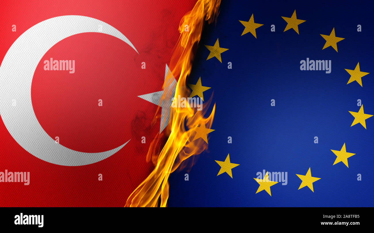 Burning Turkish and European Union flags are paired together. Realistic ...