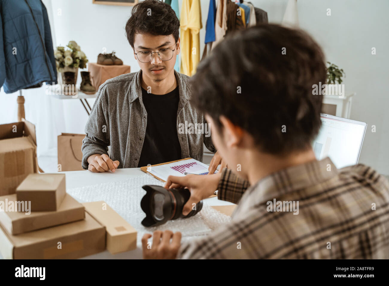 ecommerce business people selling lens product online Stock Photo - Alamy