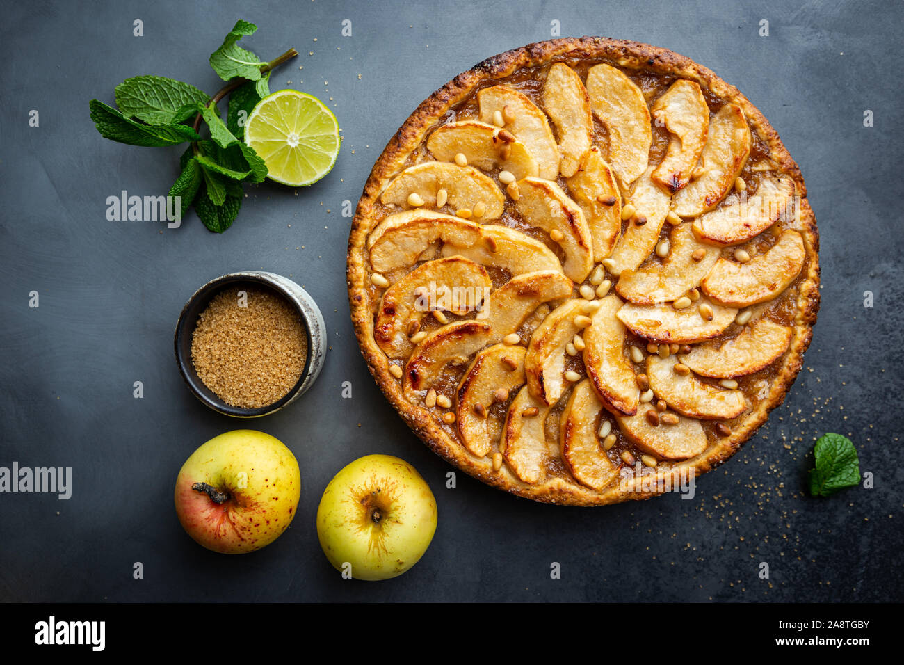 Homemade delicious fresh baked rustic apple pie on dark background, top ...