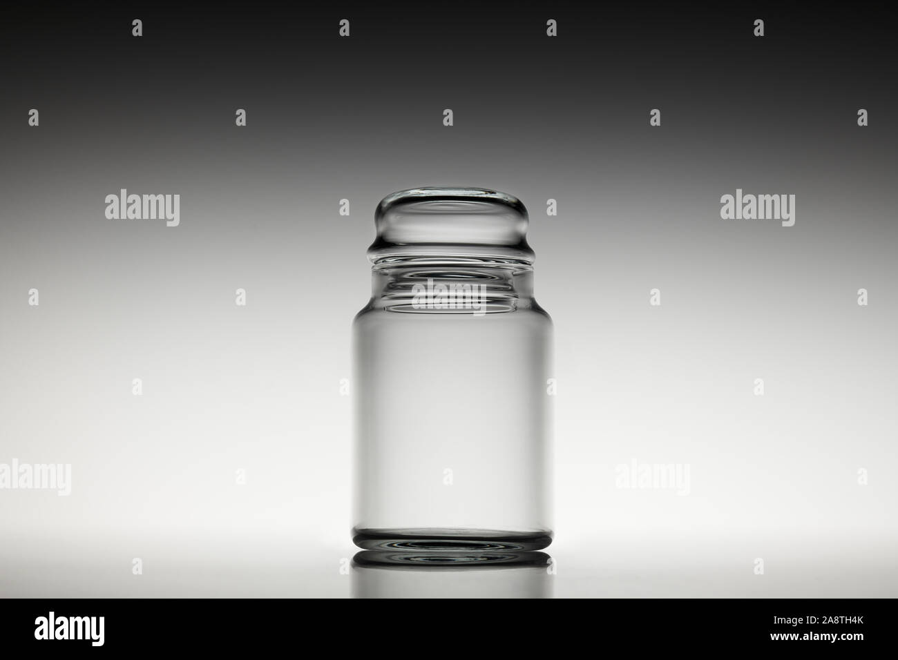 Empty glass jar on a white background Stock Photo - Alamy