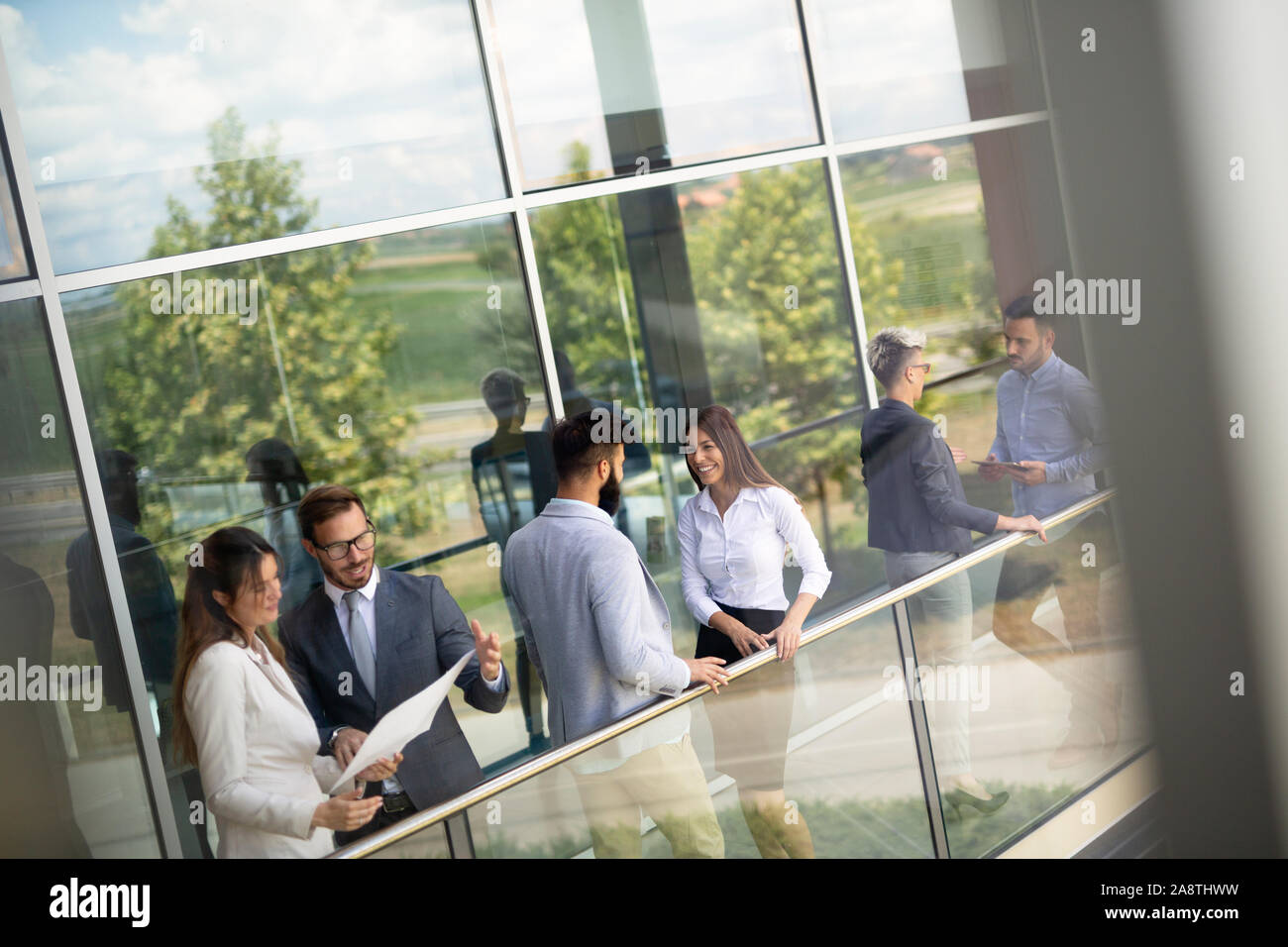 Group of perspective designers discussing in front of office Stock ...