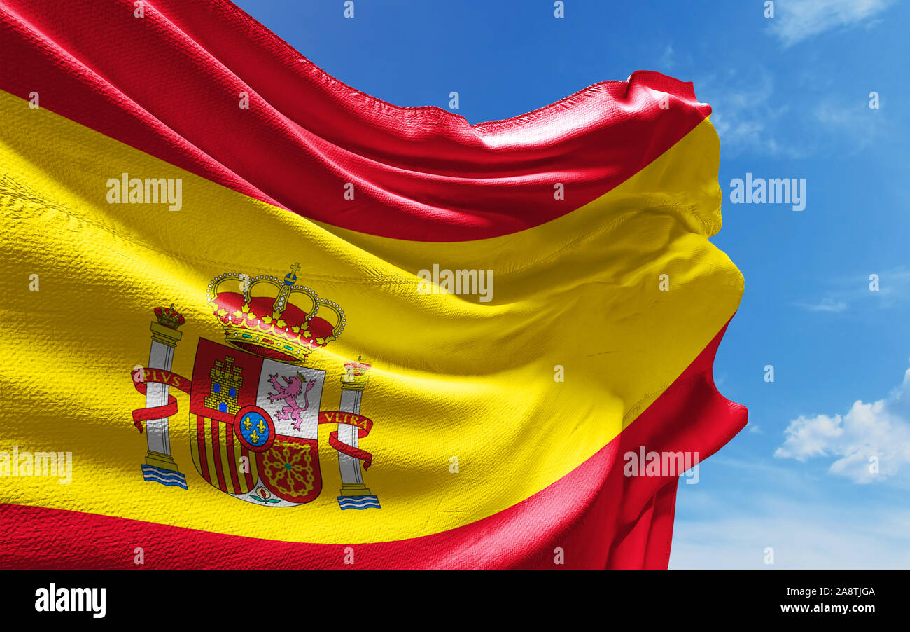 Spanish flag is waving against blue sky with clouds. Realistic ...
