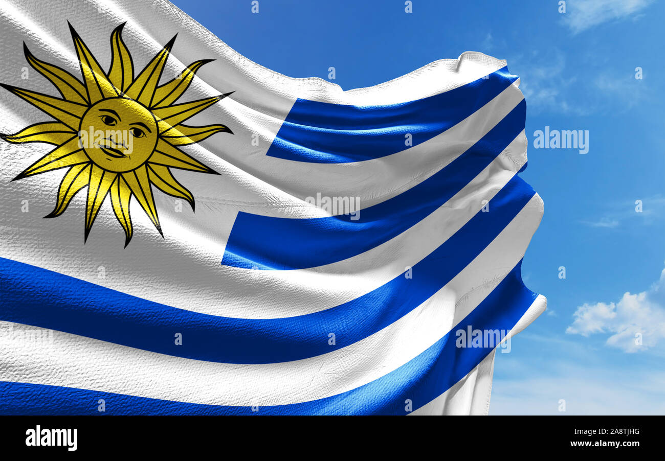 Uruguayan flag is waving against blue sky with clouds. Realistic ...