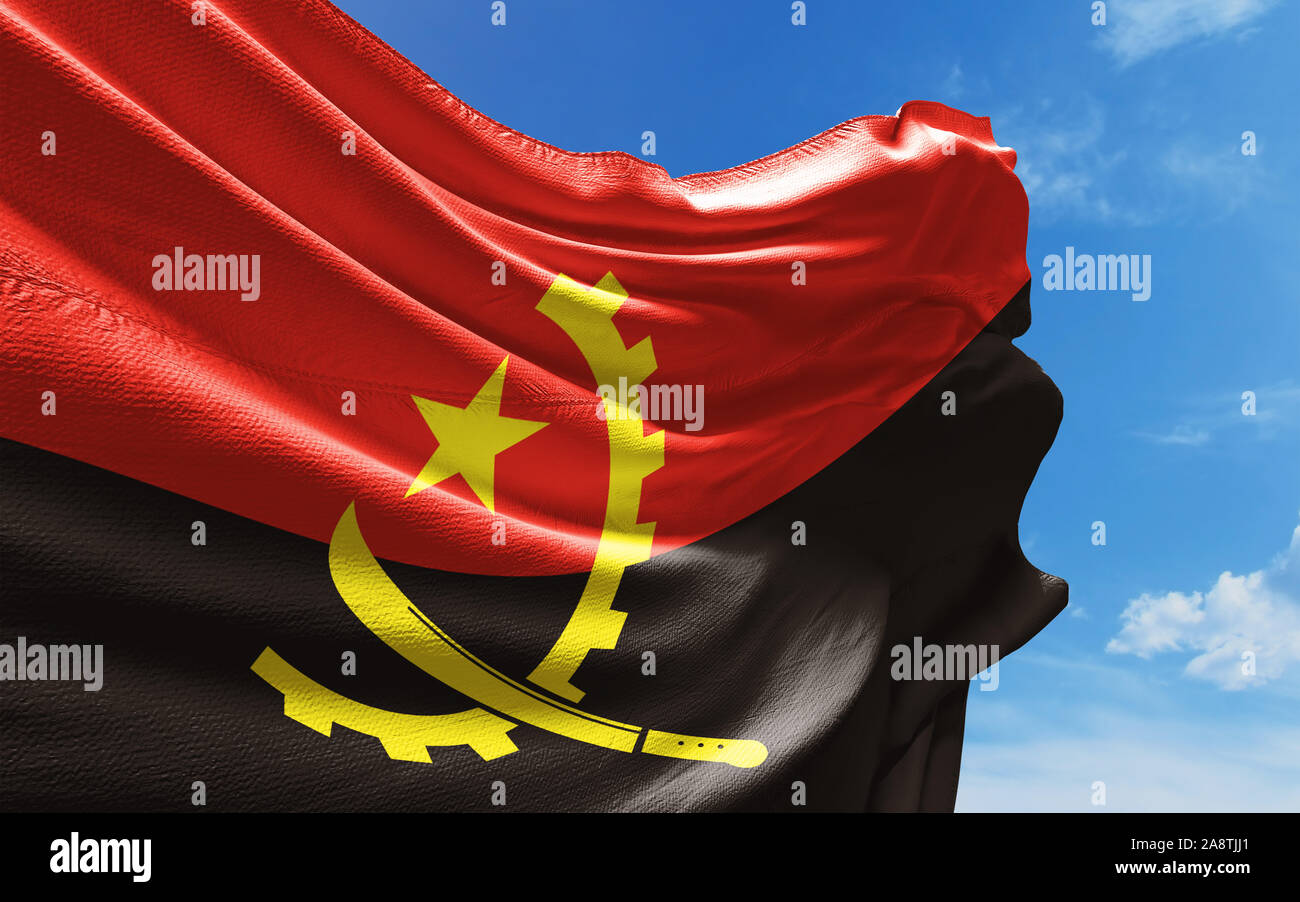 Angolan flag is waving against blue sky with clouds. Realistic ...