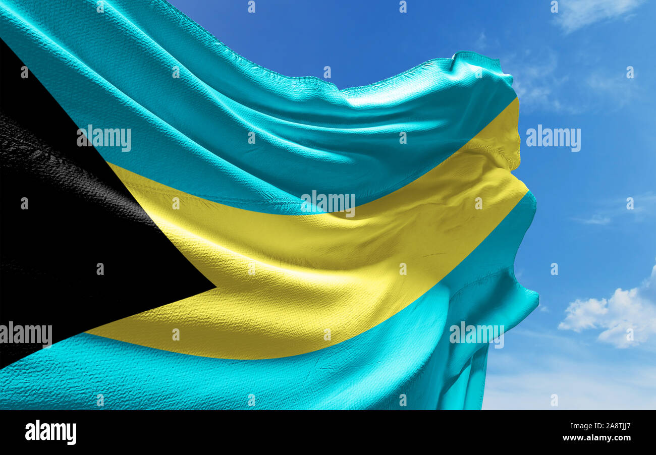 Bahamas flag is waving against blue sky with clouds. Realistic ...