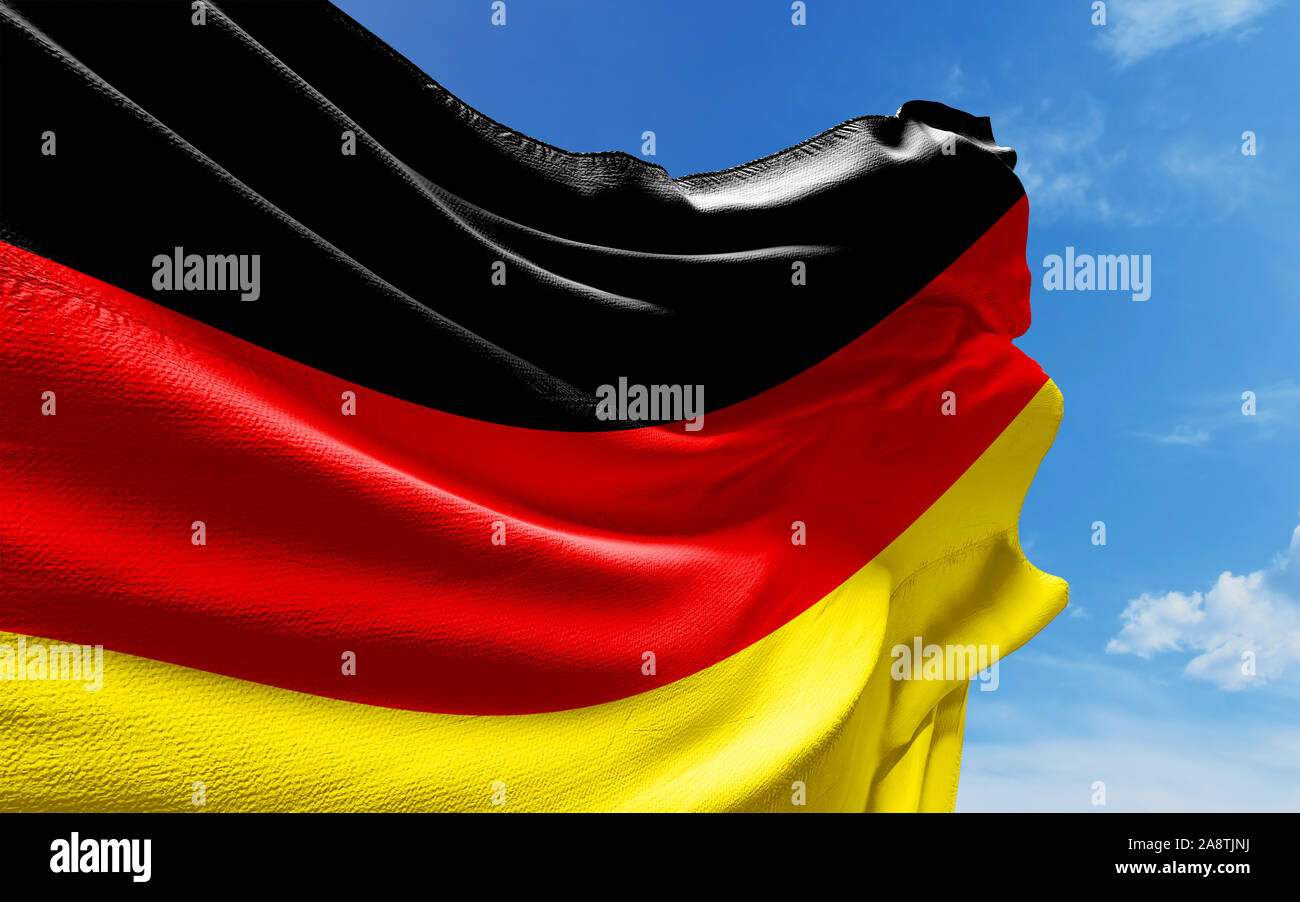 German flag is waving against blue sky with clouds. Realistic ...