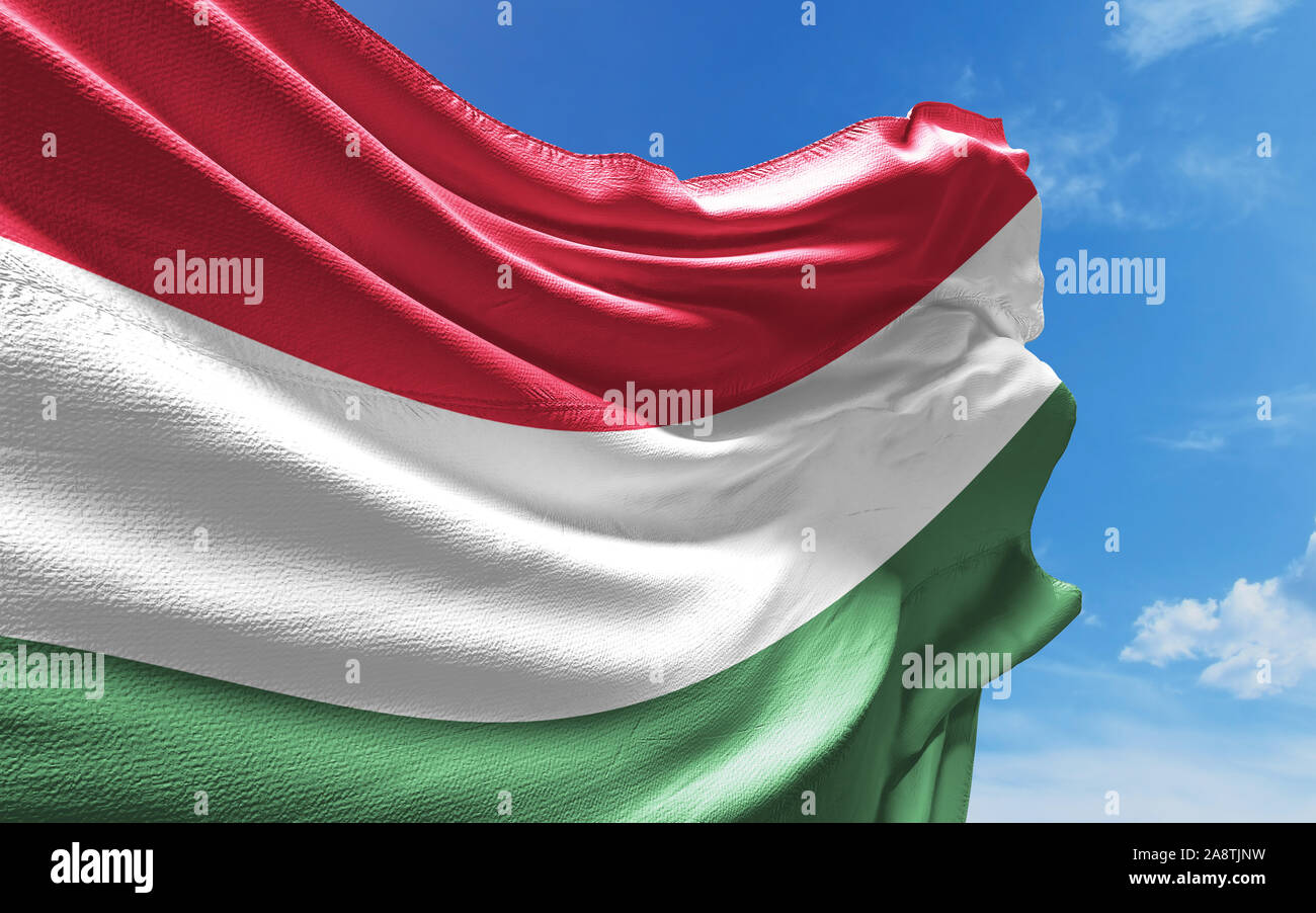Hungarian flag is waving against blue sky with clouds. Realistic ...