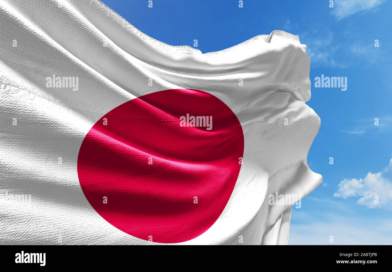 Japanese flag is waving against blue sky with clouds. Realistic ...
