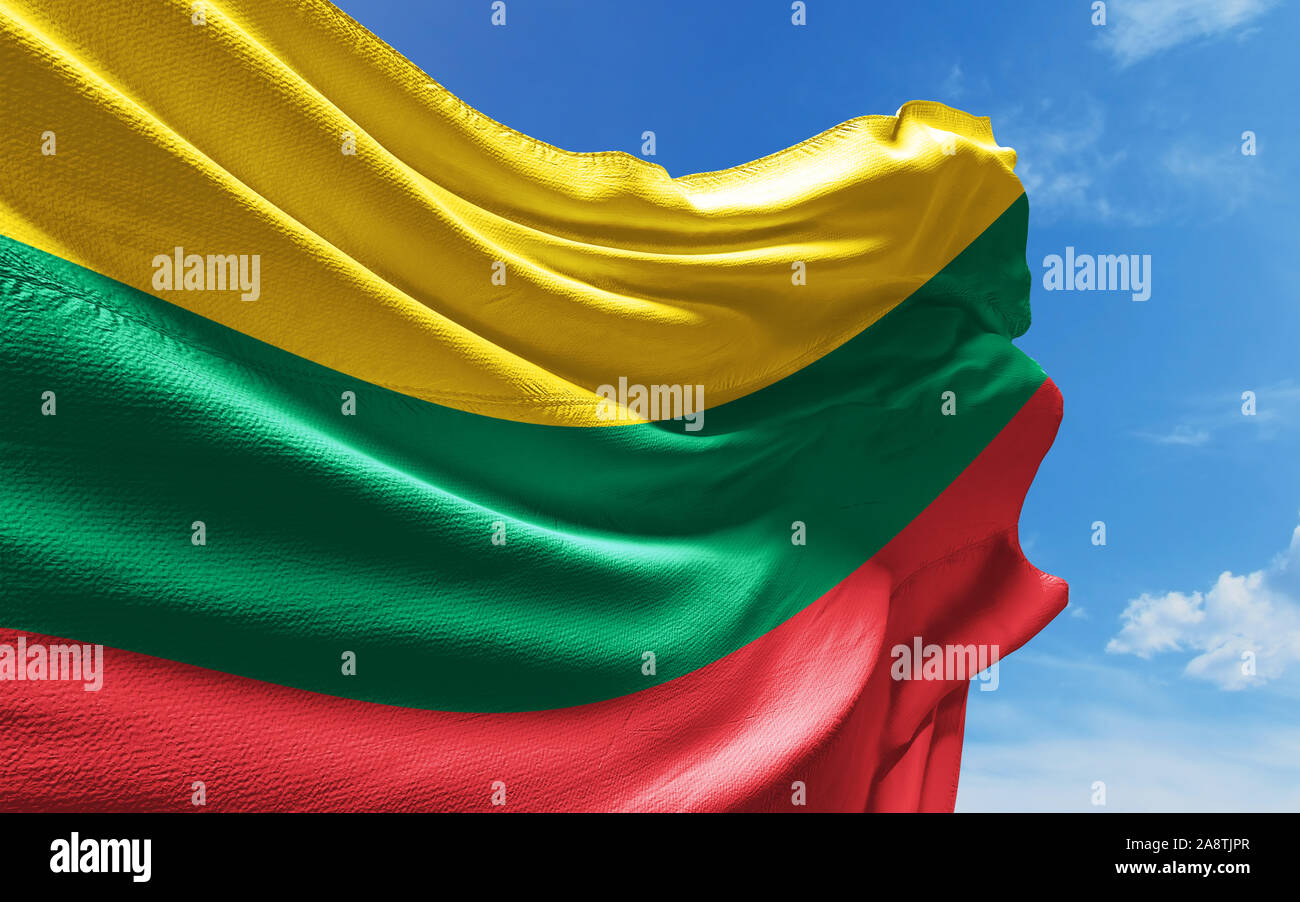 Lithuanian flag is waving against blue sky with clouds. Realistic ...