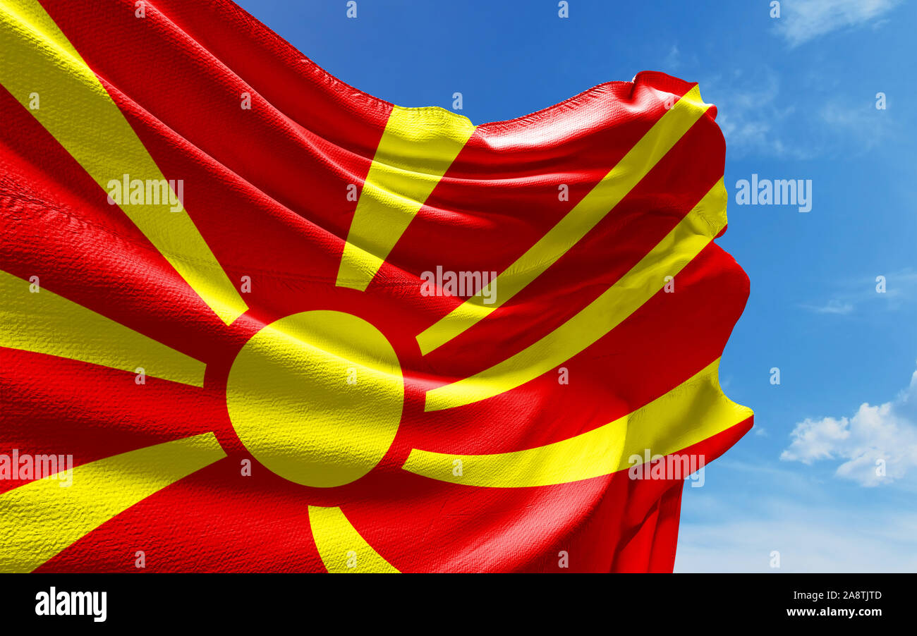 Macedonian flag is waving against blue sky with clouds. Realistic ...