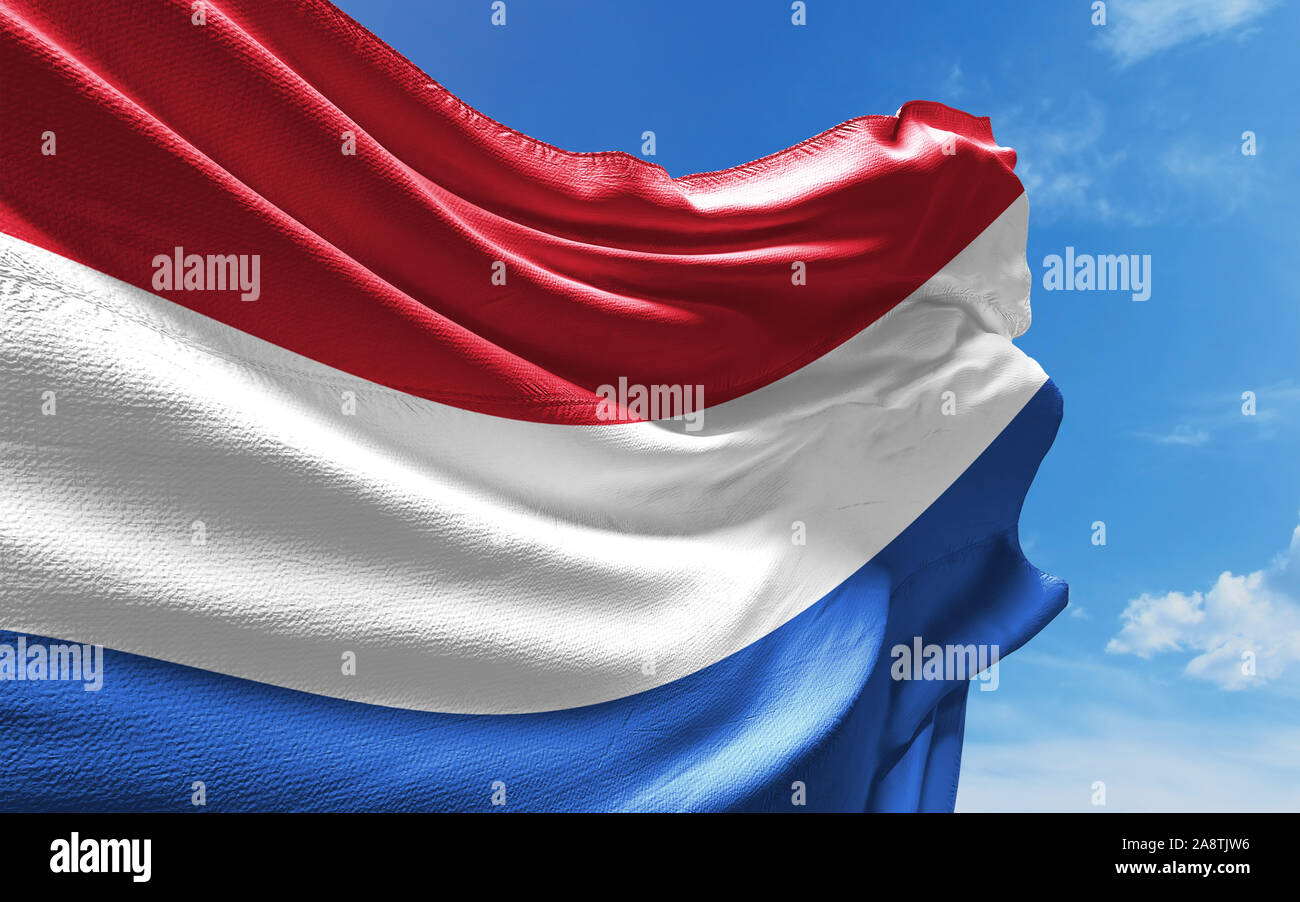 Netherlands flag is waving against blue sky with clouds. Realistic ...
