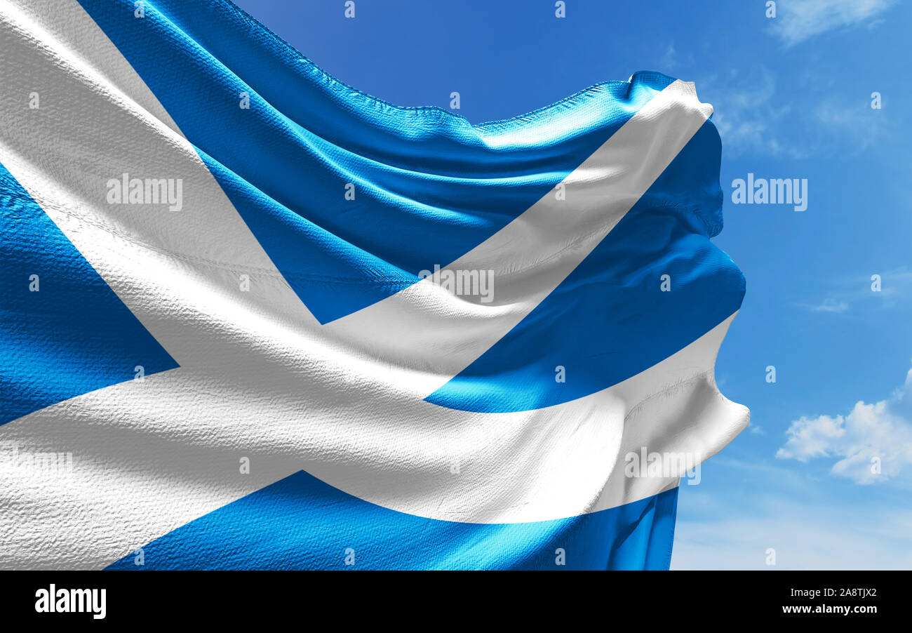 Scottish flag is waving against blue sky with clouds. Realistic ...