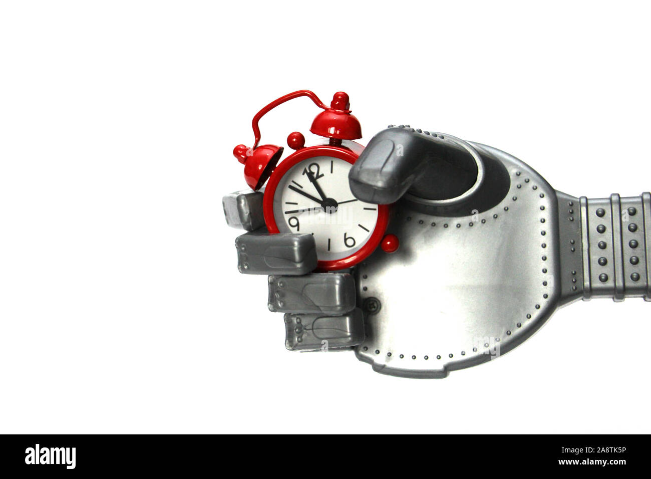 The robot holds a red clock in its hand, at which it is almost midnight ...