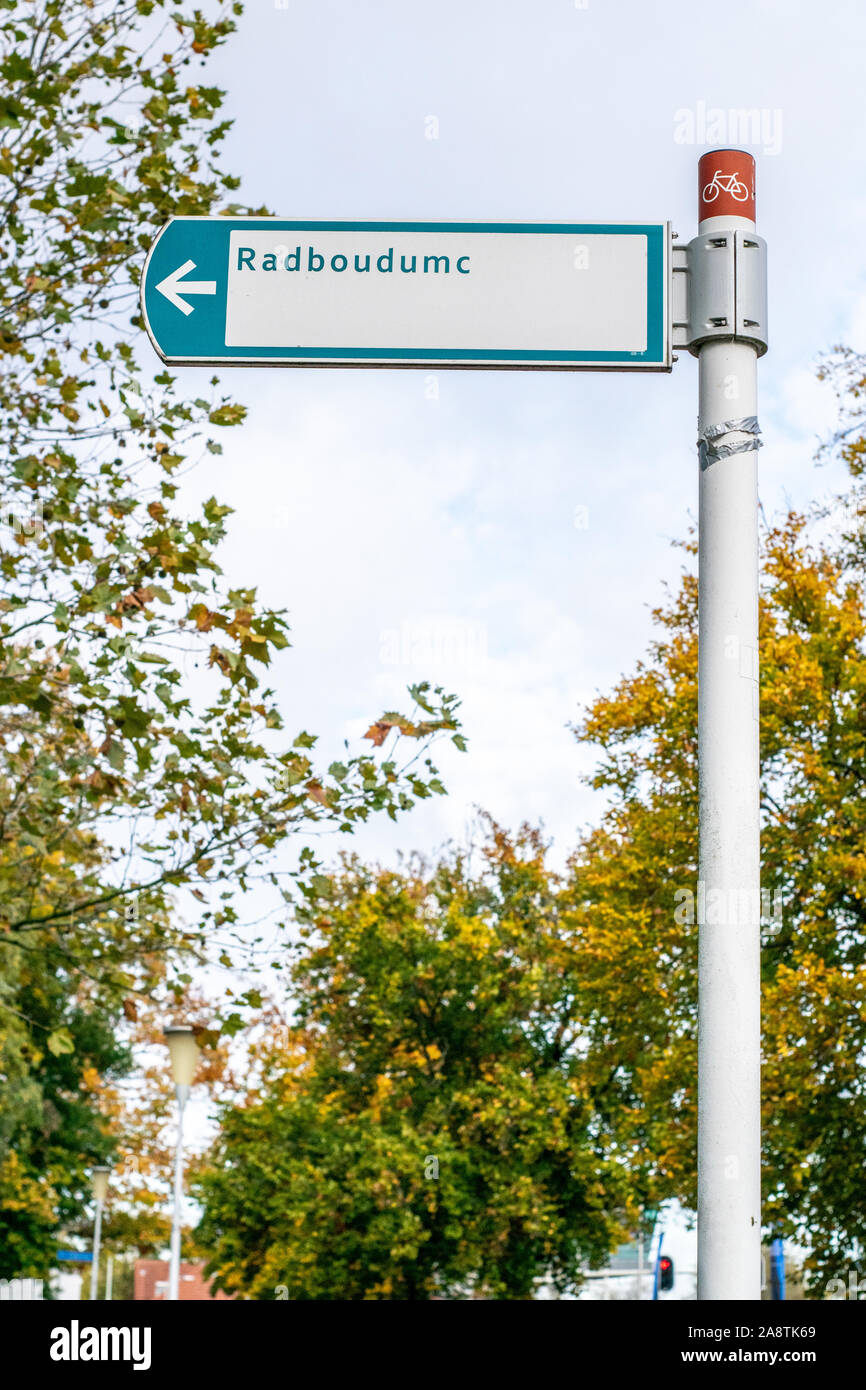 Bicycle paths guide. White sign with city names, The Netherlands Stock ...