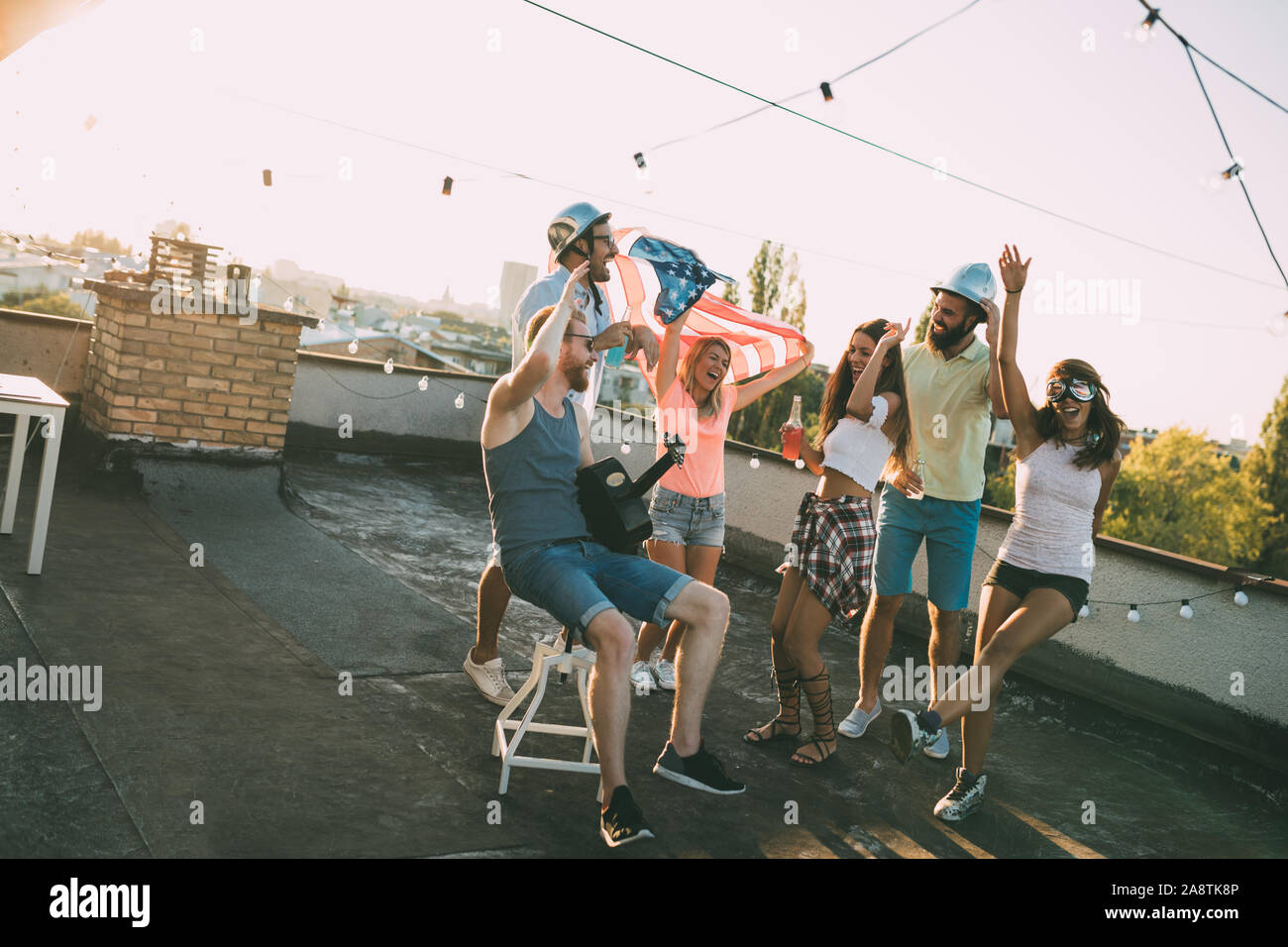 Having a great time with friends, havinf fun at rooftop party Stock ...