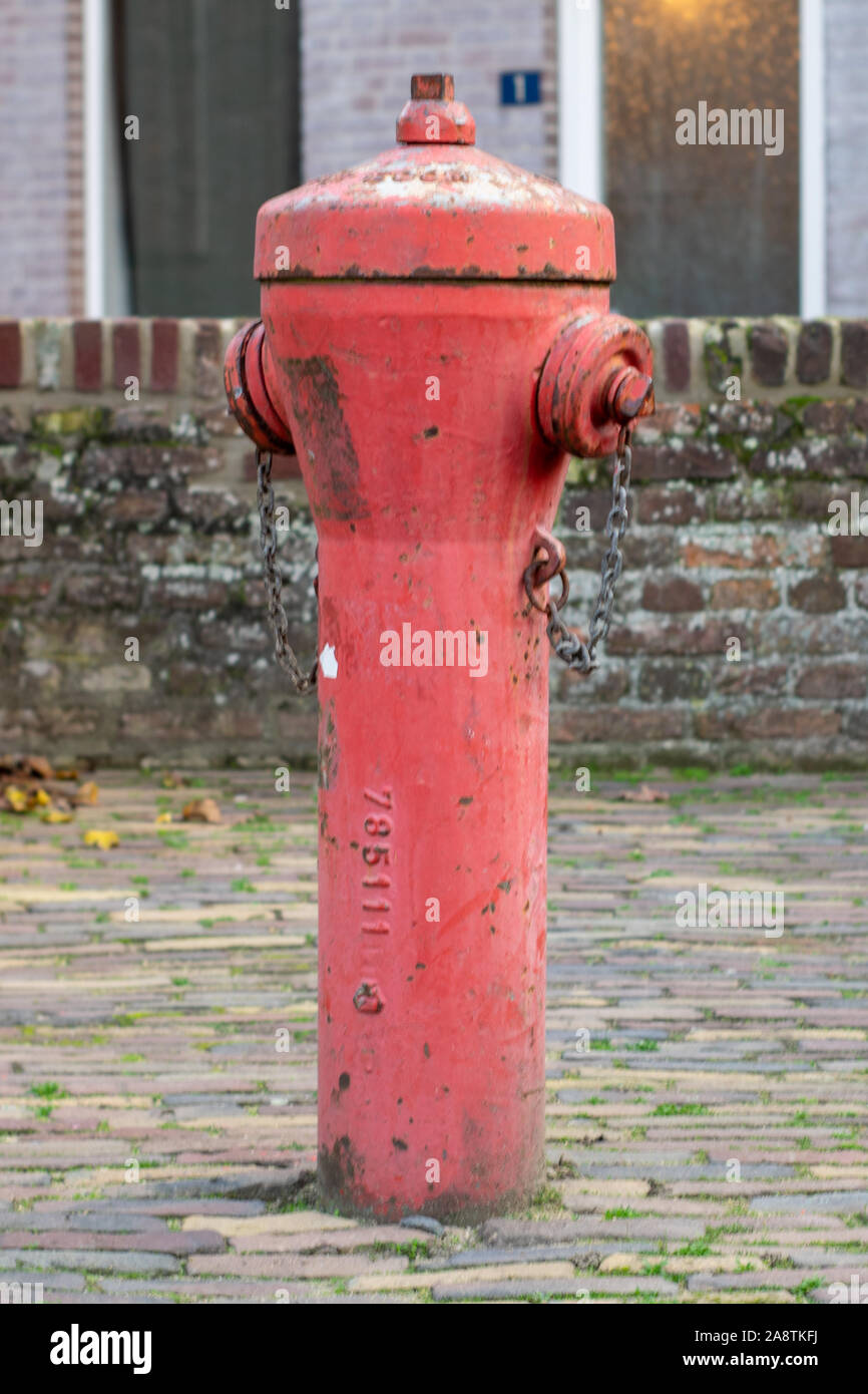 A Typical old Dutch red Hydrant standing in the City Stock Photo - Alamy