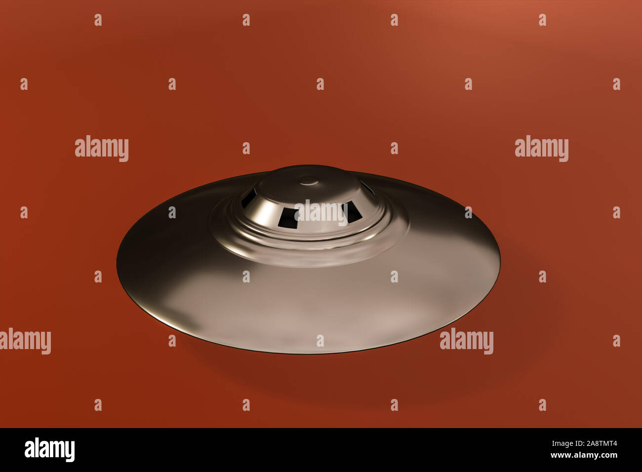 unidentified flying object isolated on red background Stock Photo - Alamy