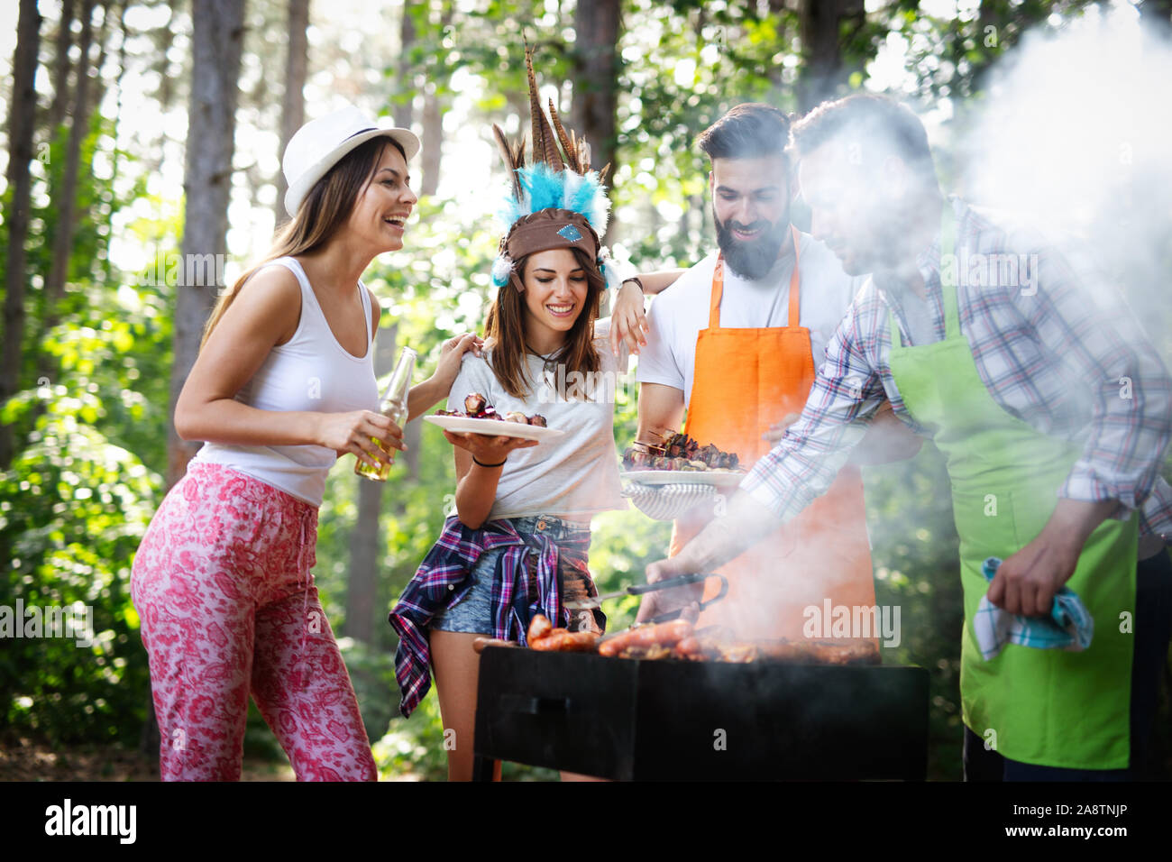 Group friends doing bbq in hi-res stock photography and images - Alamy