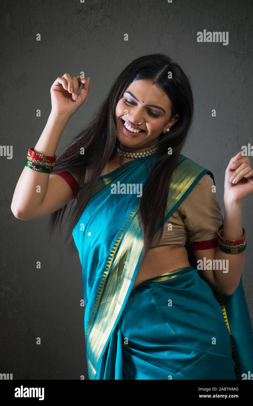 young woman dancing in saree Stock Photo - Alamy