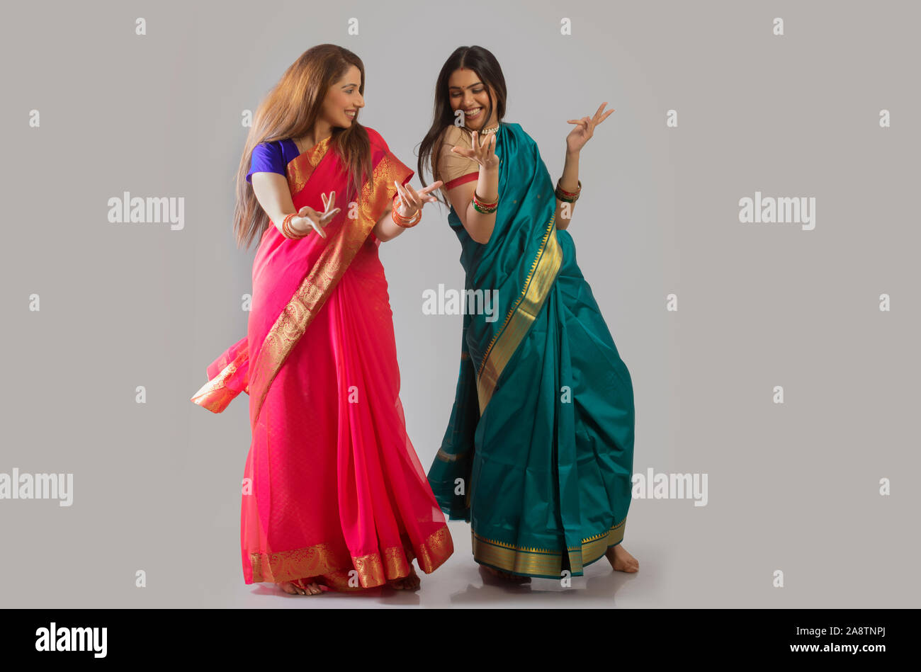 young women dancing in saree Stock Photo - Alamy