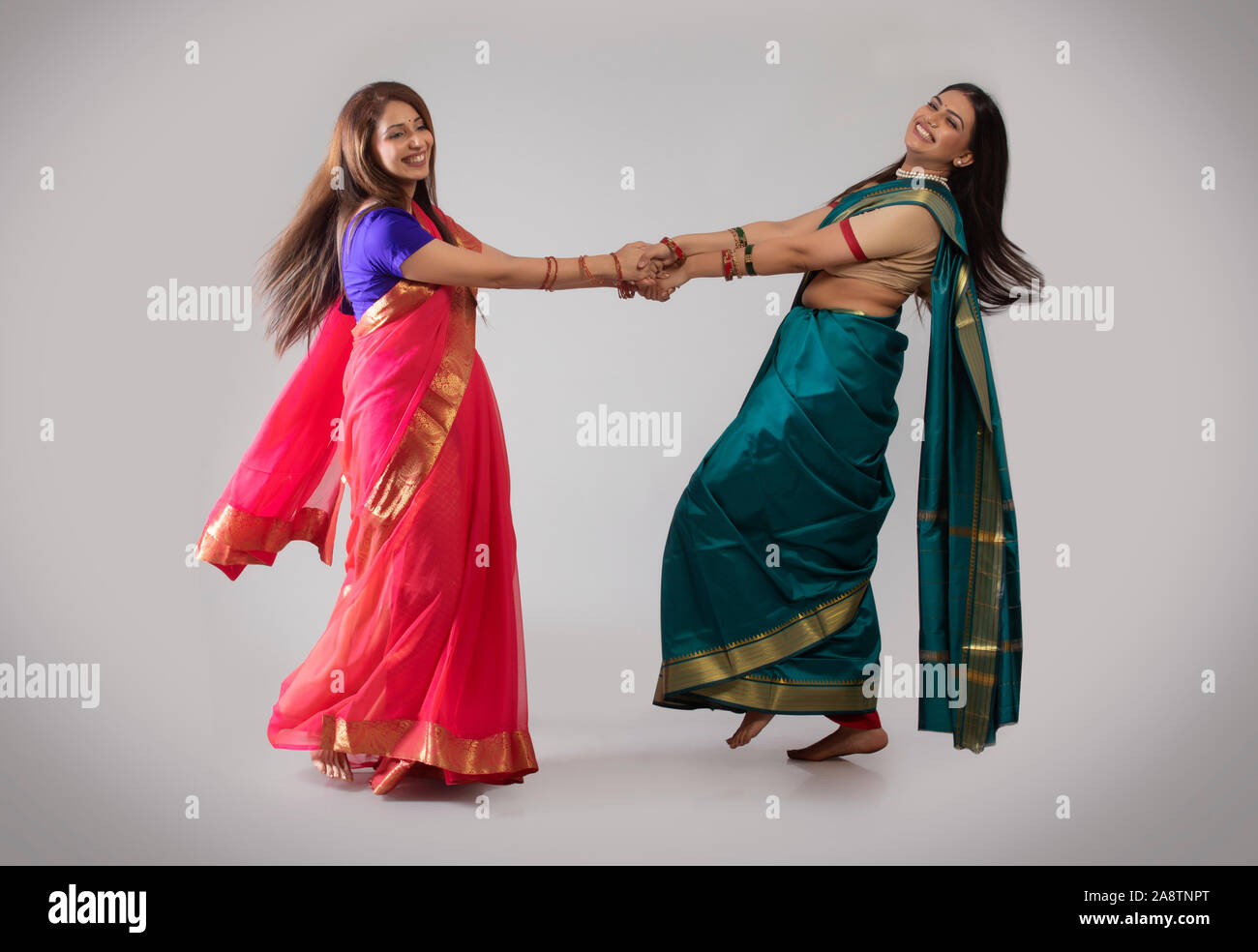young women dancing in saree Stock Photo - Alamy